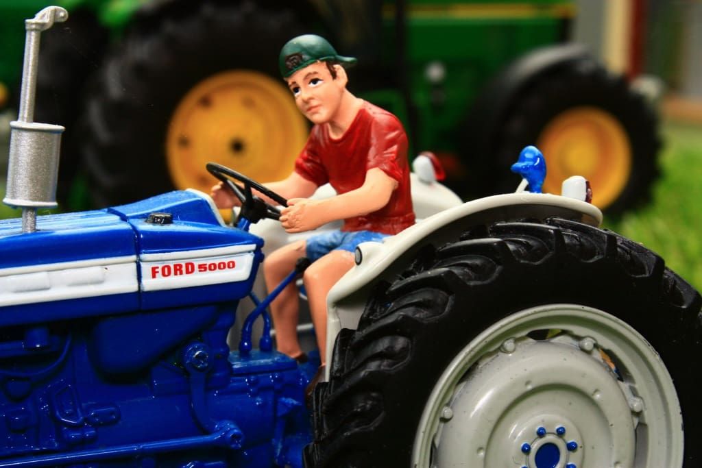 AT32141 AT Collections Jeff The Teenager Figure Driving Tractor ...